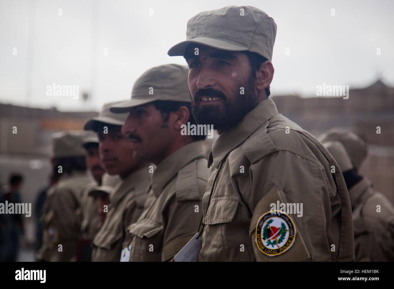 Local men stand in formation at Combat Outpost Senjaray, Kandahar ...