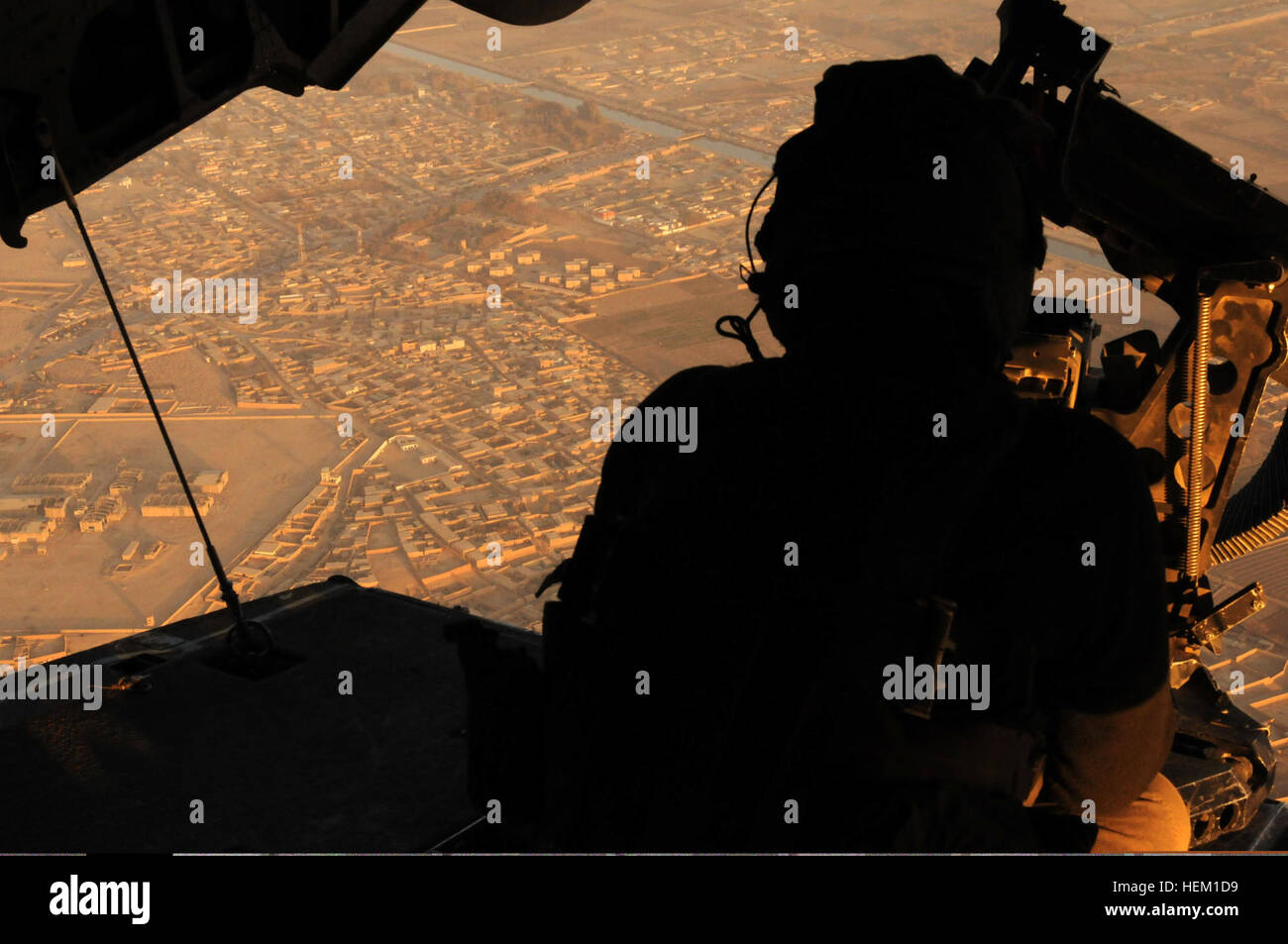 A British Royal Air Force (RAF) airman provides rear security on board ...