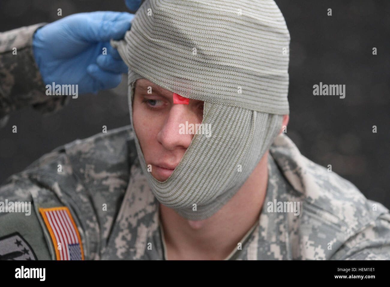 Sgt. Randal Blake, 14th Military Police Brigade, gets treated as he ...