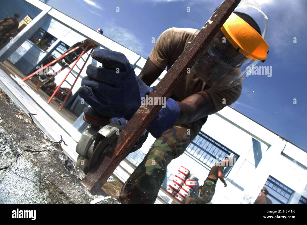 Construction Electrician Castro Amoakoh, with the U.S. Navy Mobile ...