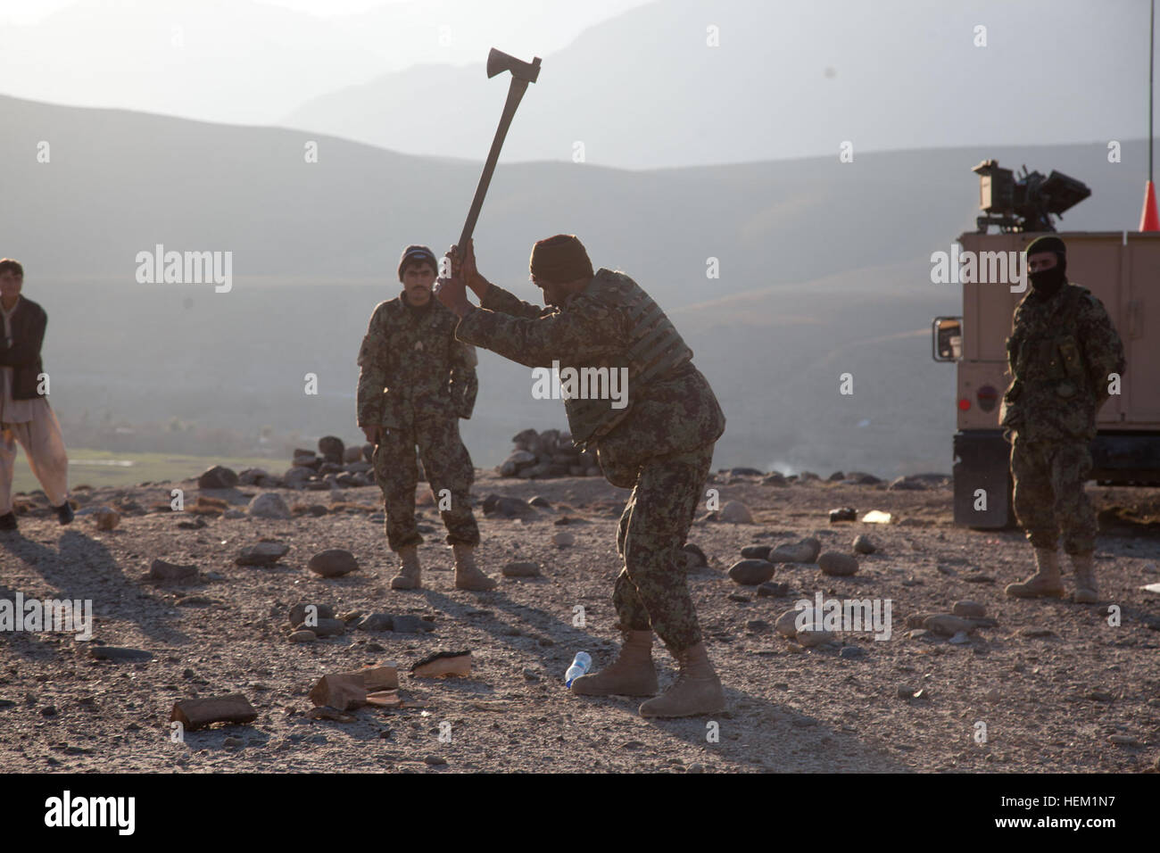 An Afghan National Army soldier chops wood during Operation Chromium ...