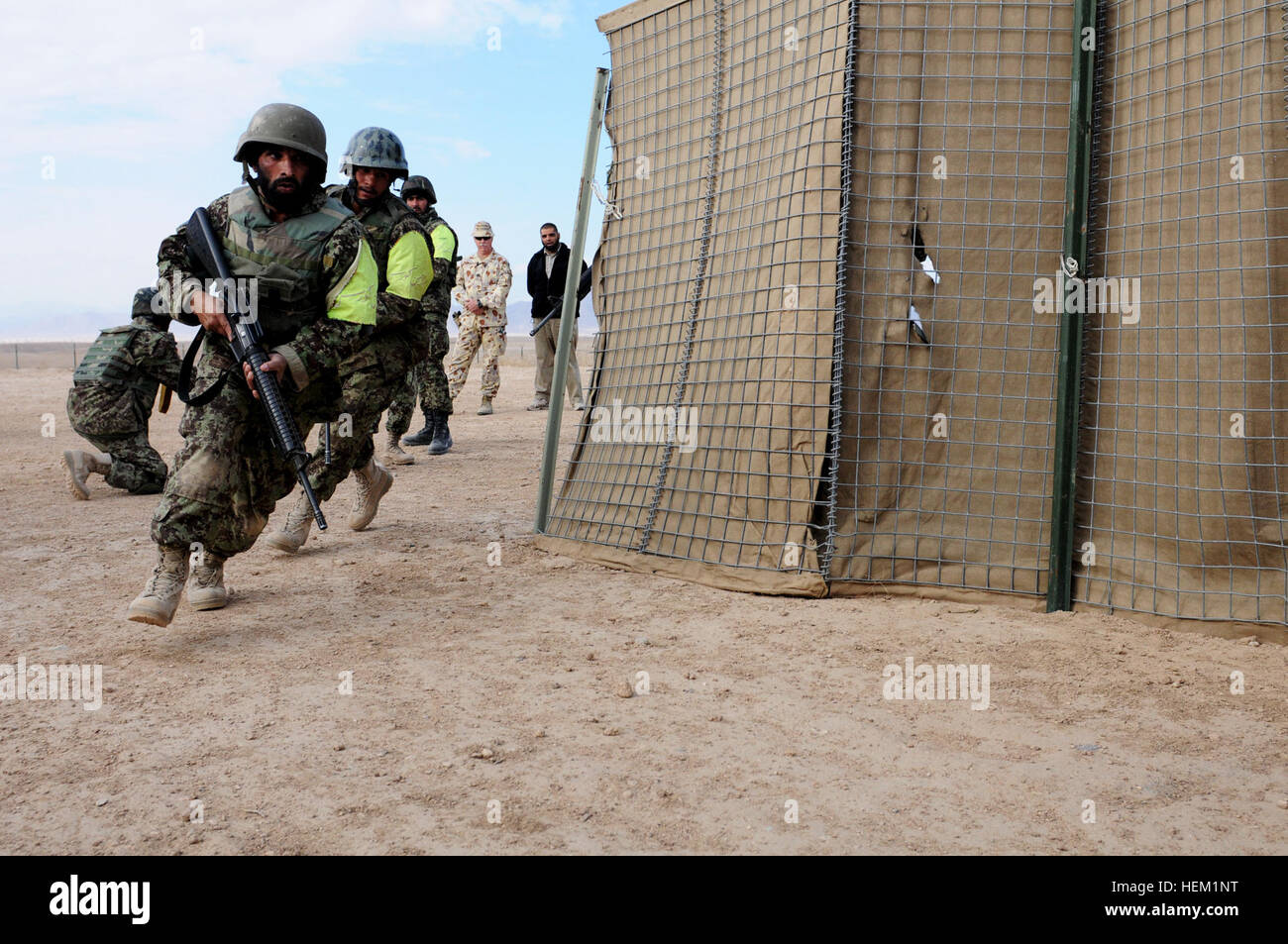 Afghan National Army soldiers simulate clearing a compound with help ...