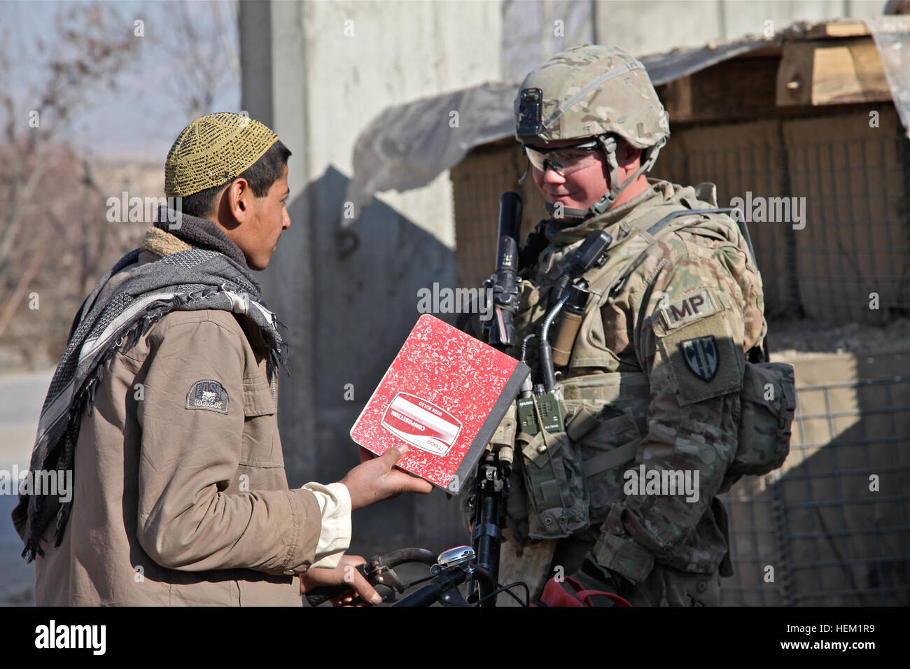 A U.S. Army military police soldier from 527th Company interacts with a ...