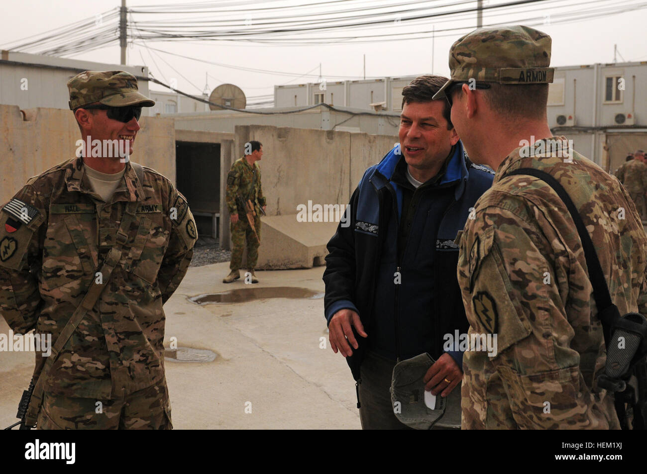 Senator Mark Begich (D-AK) speaks to Sgt. Chris S. Wall, ammunition ...