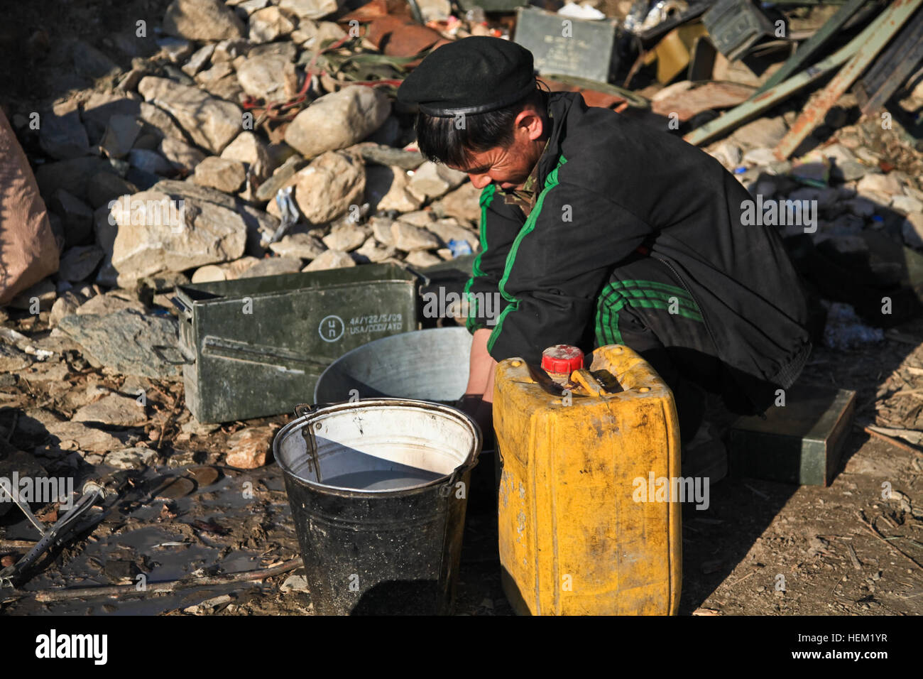 An Afghan National Army soldier from the 6th Kandak washes clothes at ...