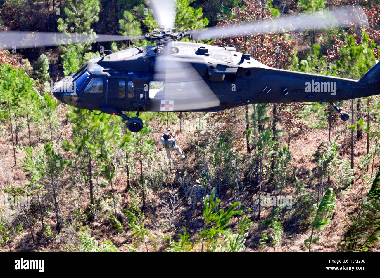 A flight medic of 6th Battalion, 101st Combat Aviation Brigade lowers ...
