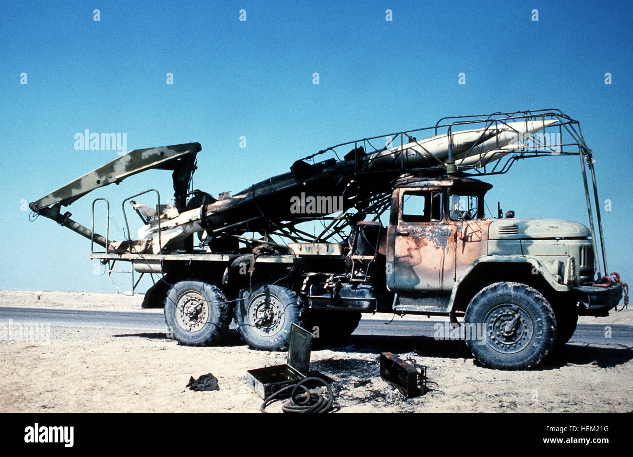 Scorched Iraqi SA-6 surface-to-air missiles stand atop a Soviet ZIL-131 ...