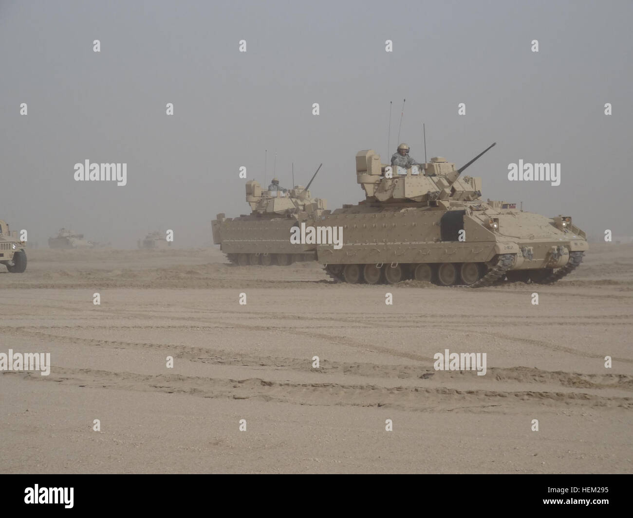 M1A2SEP Abrams Tanks and M2A3 Bradley Fighting Vehicles maneuver across ...
