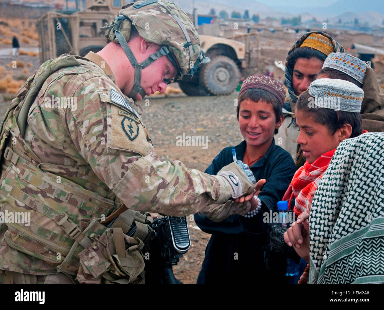U.S. Army Pfc. Wayne Ellis, left, with the 3rd Platoon, Alpha Battery ...
