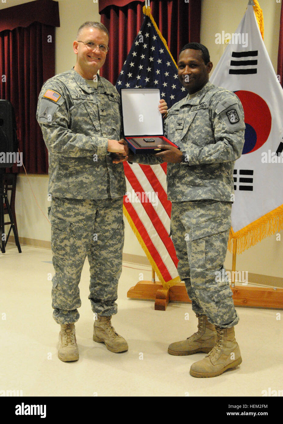 Col. Darrell Duckworth, commander, 501st Sustainment Brigade, presents ...