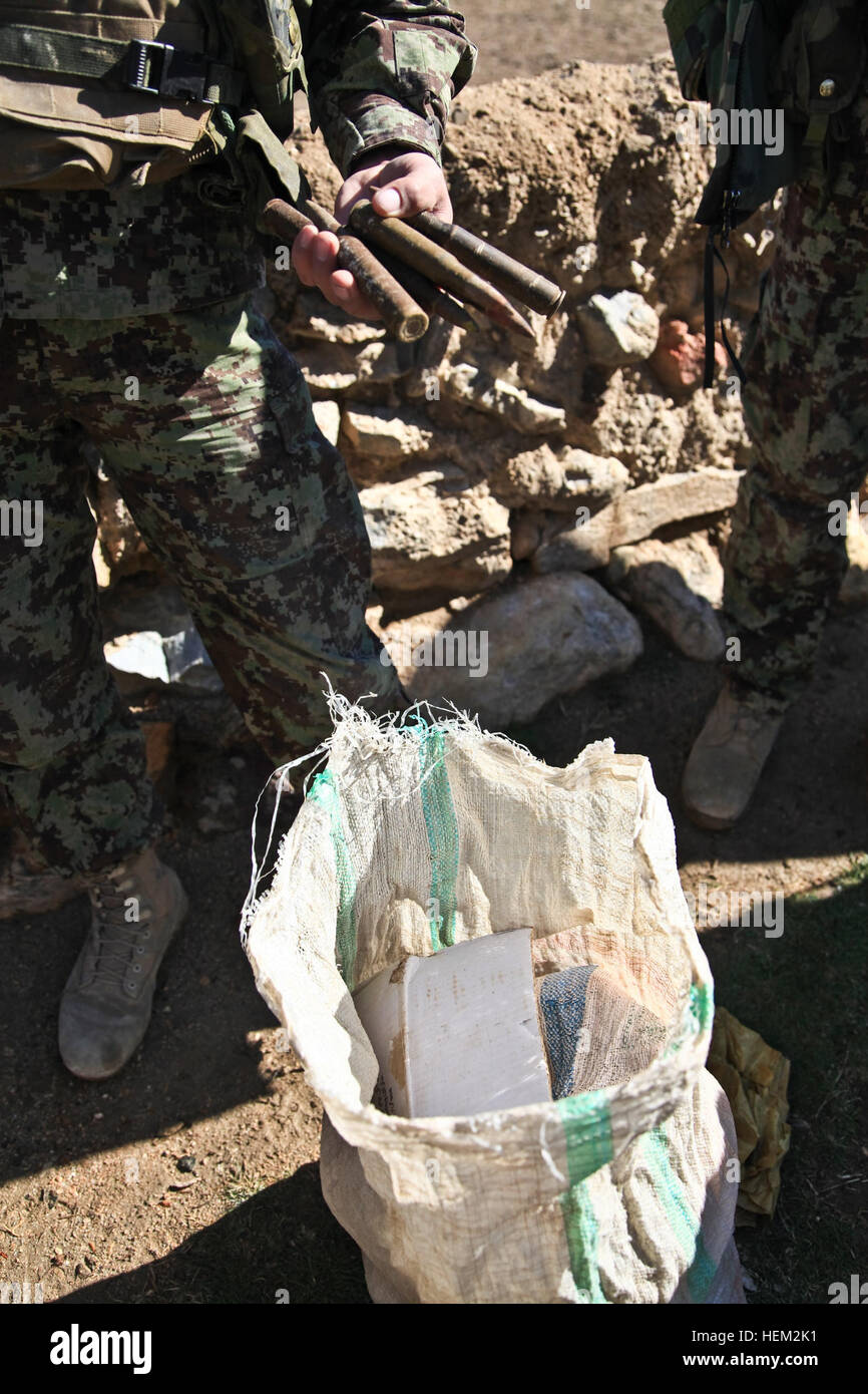 An Afghan National Army soldier holds anti-aircraft ammunition found in ...
