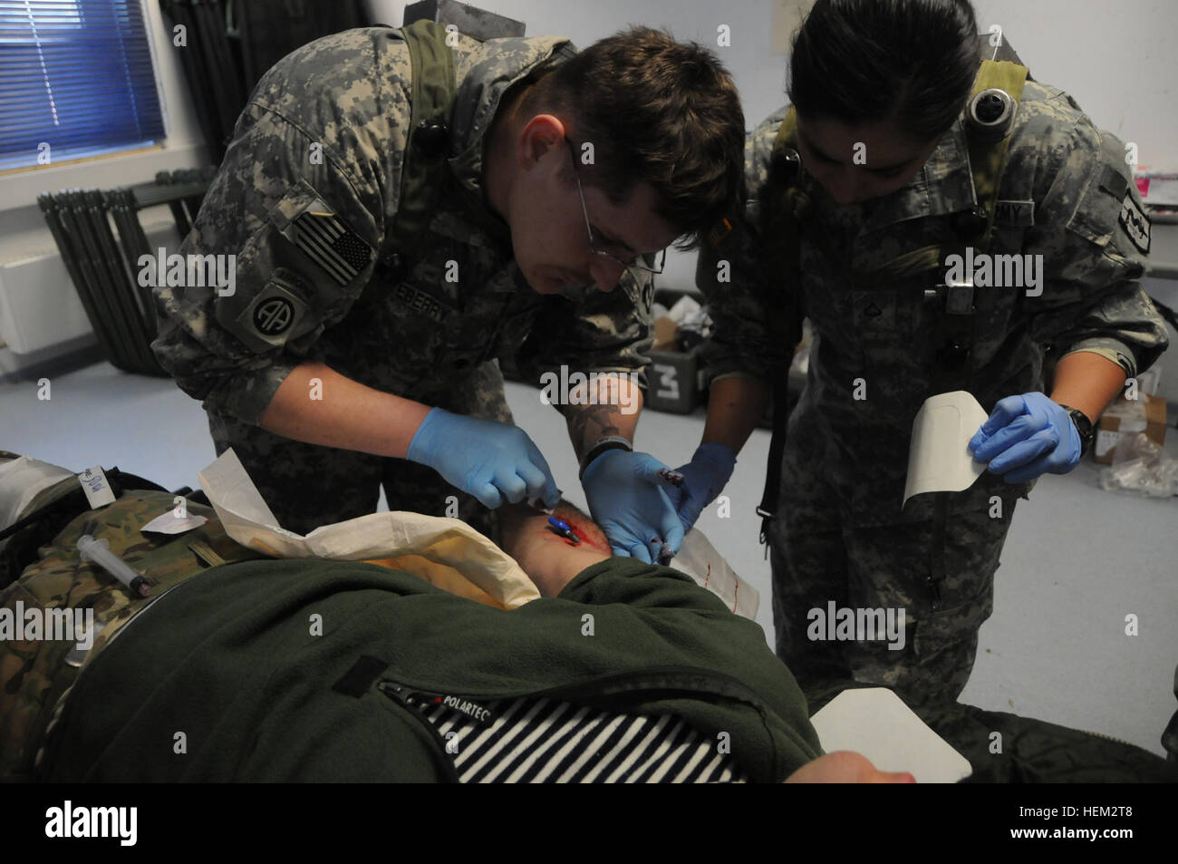 U.S Army Soldiers of the 557th Medical Company prepare a patient’s arm ...