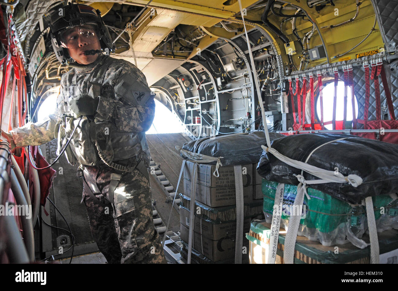 A soldier from 1st Combat Aviation Brigade, prepares to unload an LCLA ...