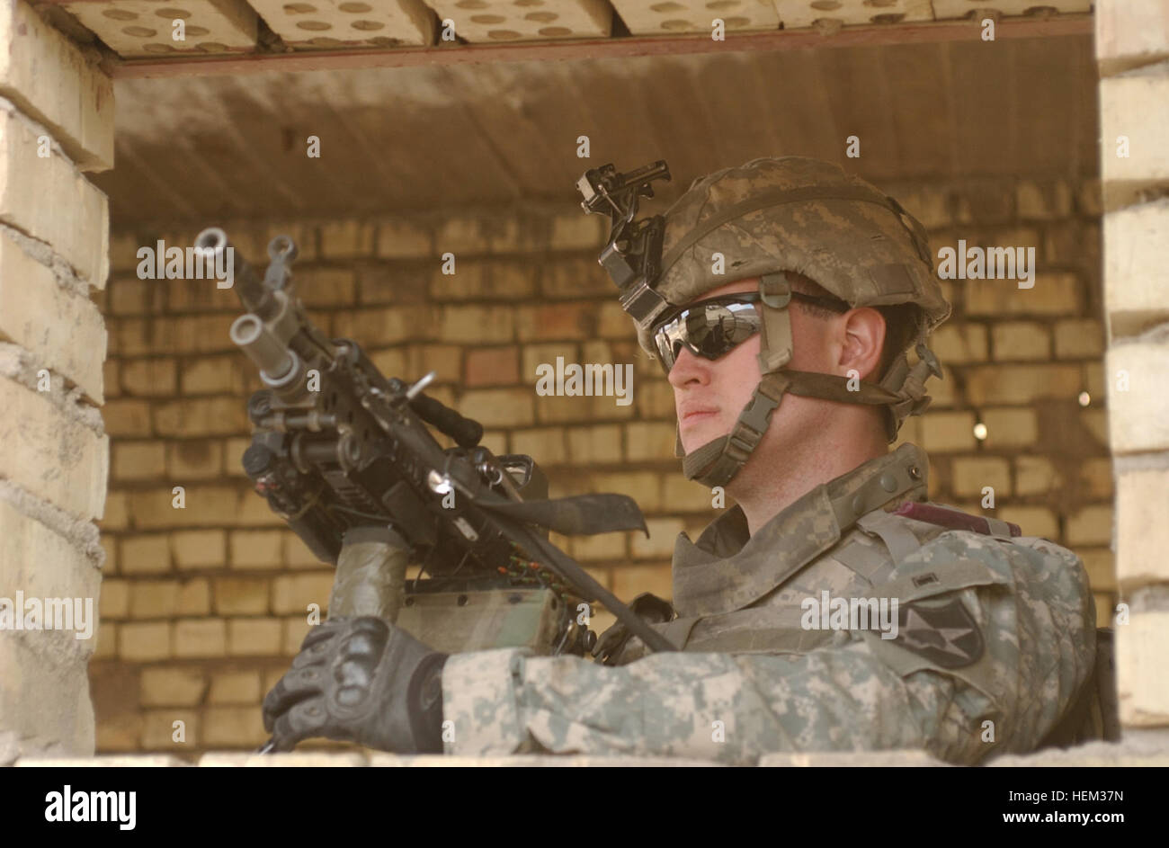 U.S. Army Specialist Craig Donovan, an M-249 Squad Automatic Weapon ...