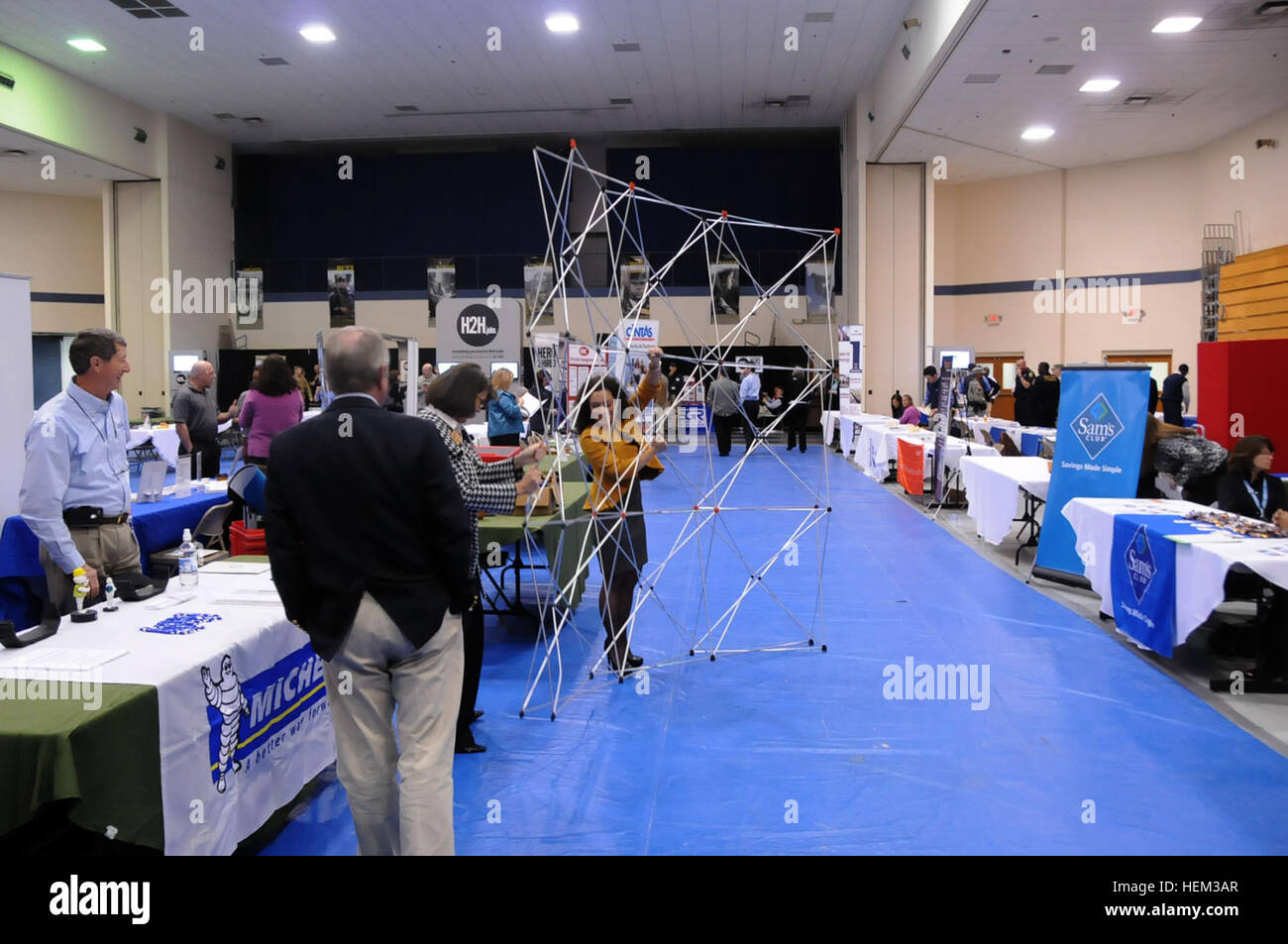 A representative from Colonial Life sets up the company display just ...
