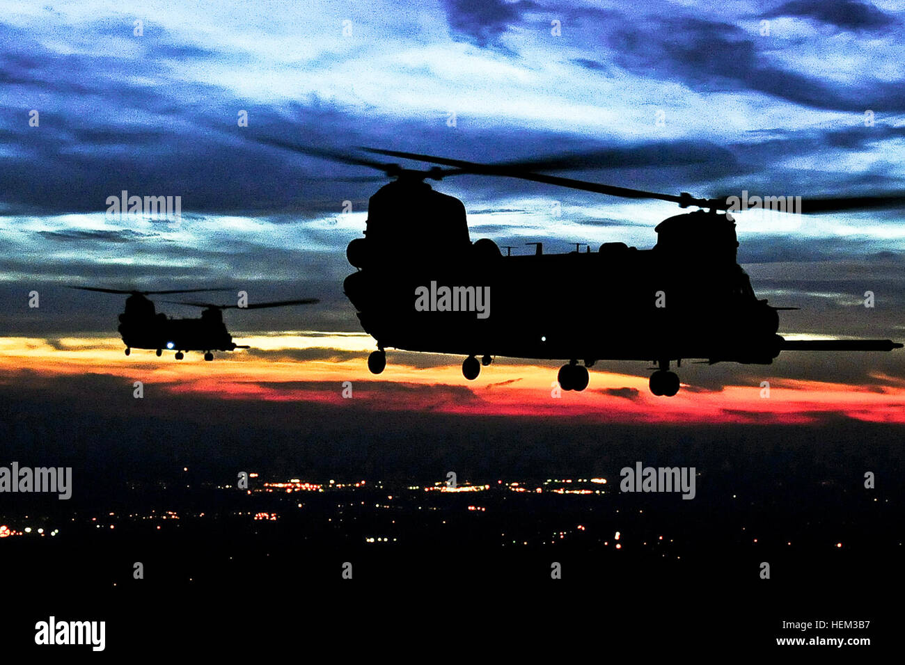 U.S. Army CH-47 Chinook helicopters continue a mission after being ...