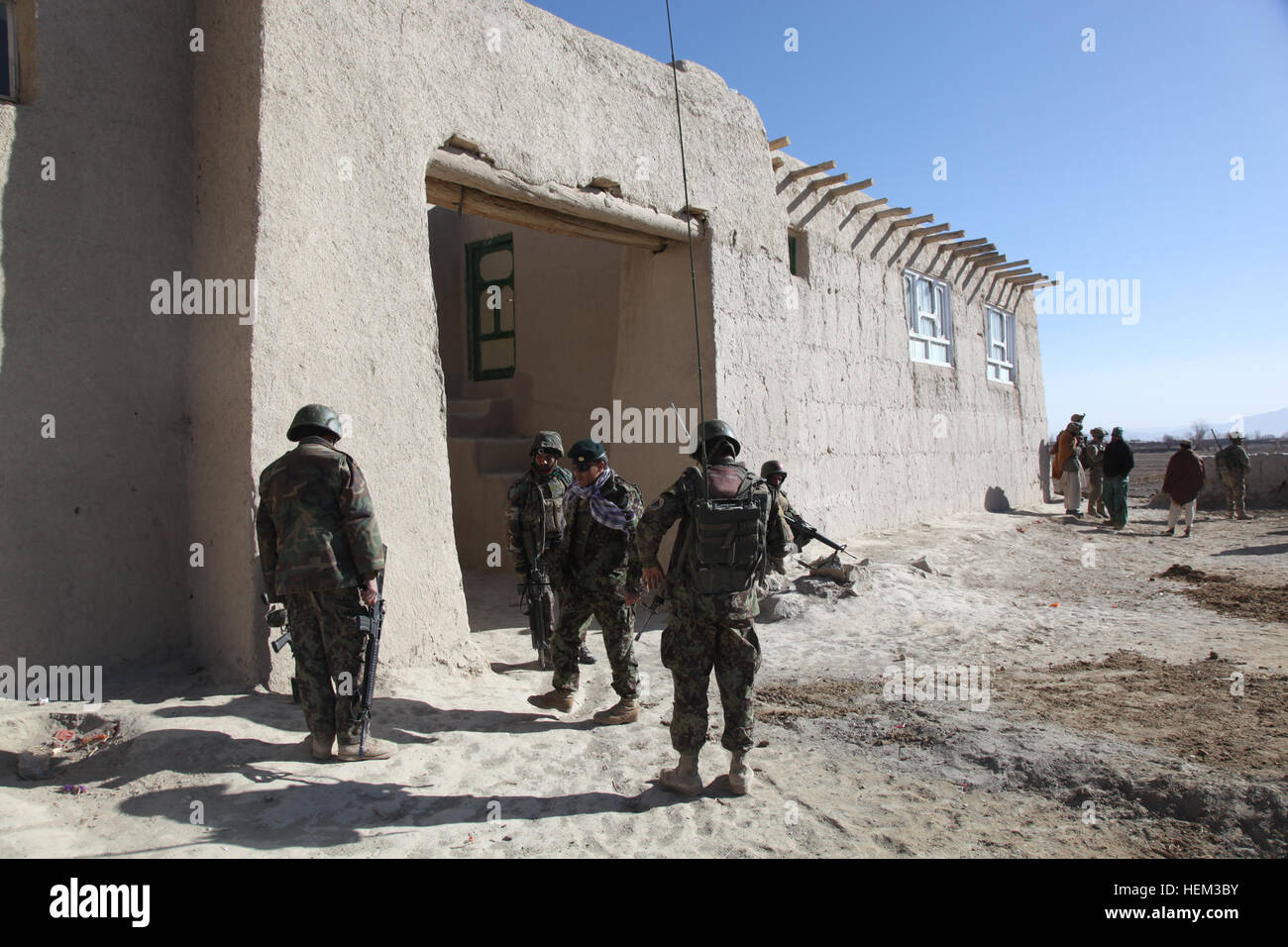 Afghan National Army soldiers clear a house in the town of Kolagu ...