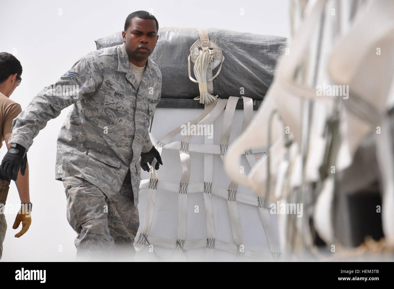 Air Force and Army personnel load container delivery systems of water ...
