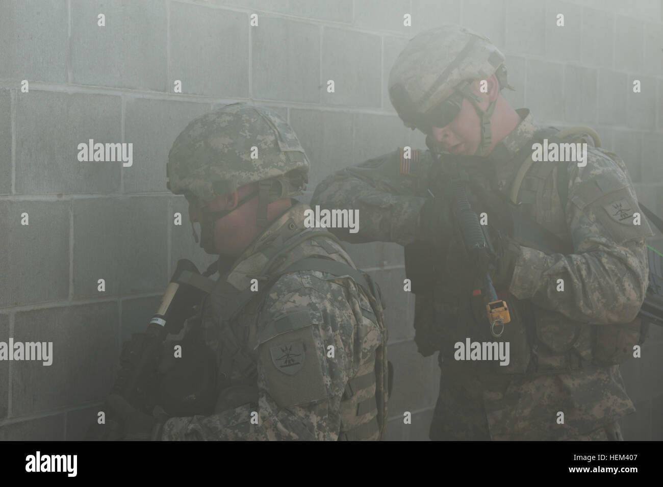 Staff Sgt. Patrick Hoglund and Capt. Robert Bohl search buildings for ...
