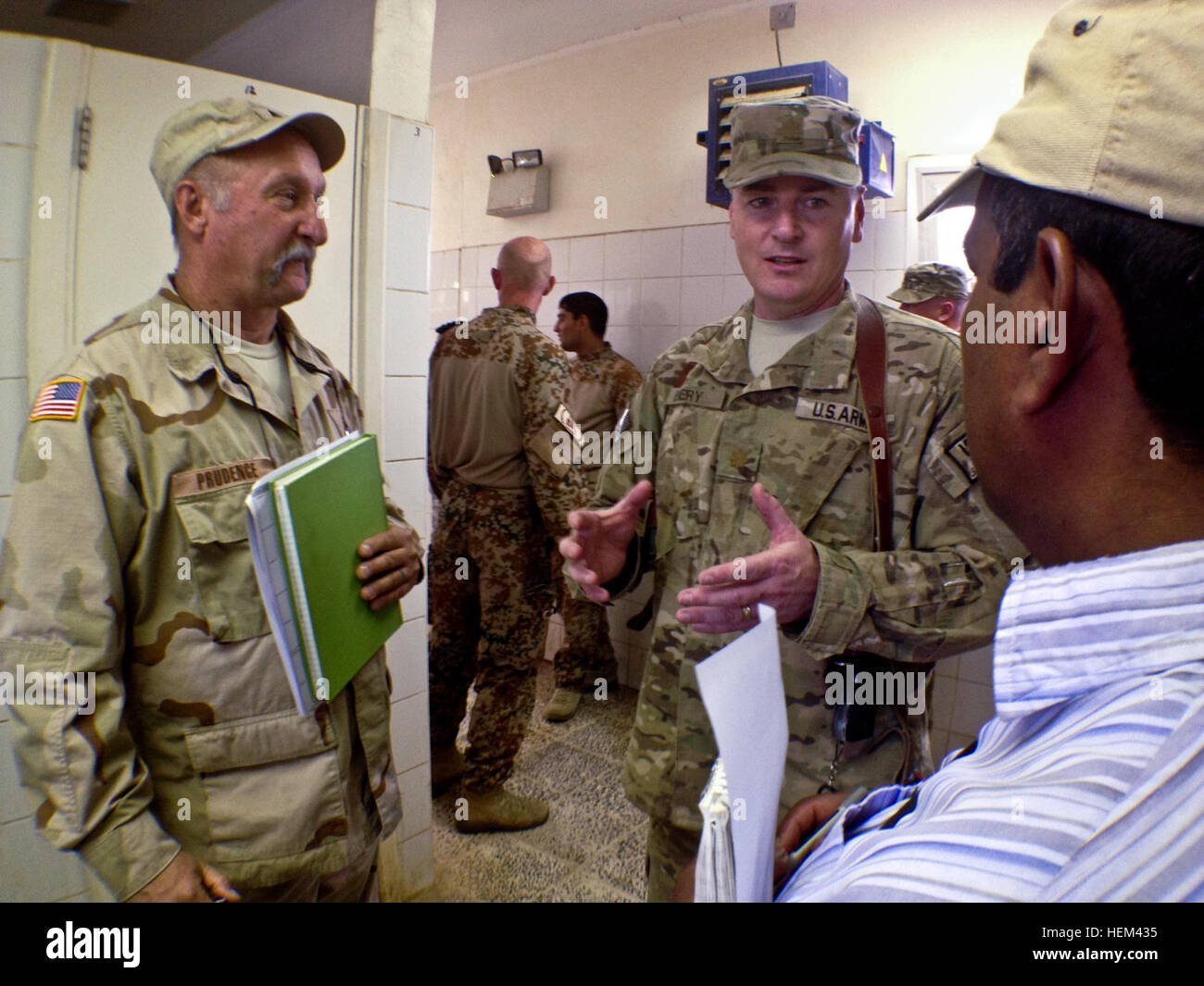U.S. Army Maj. Burlin Emery, second from right, an engineer adviser ...