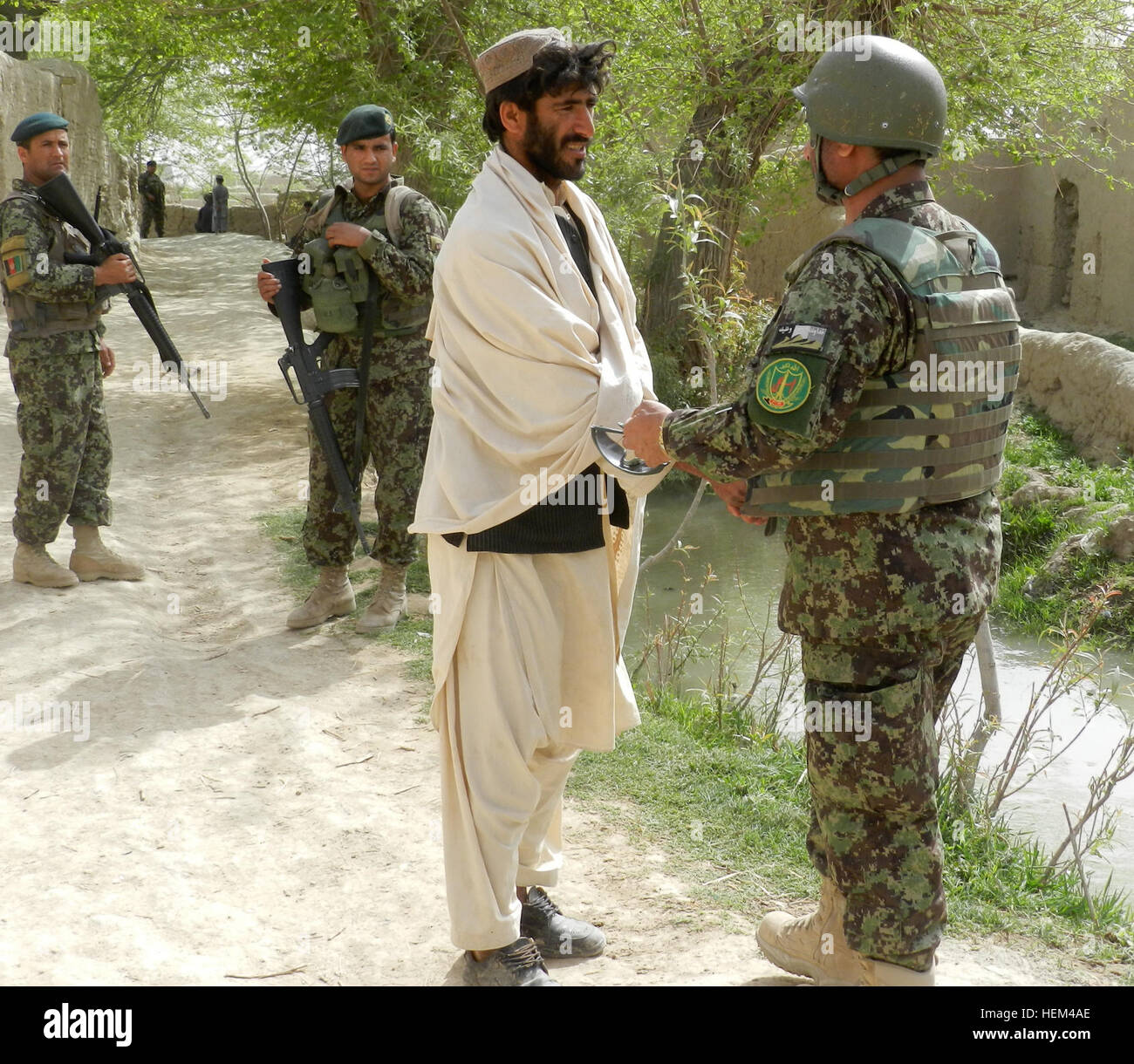 Police officers from the Panjwa’i Police conduct security operations ...