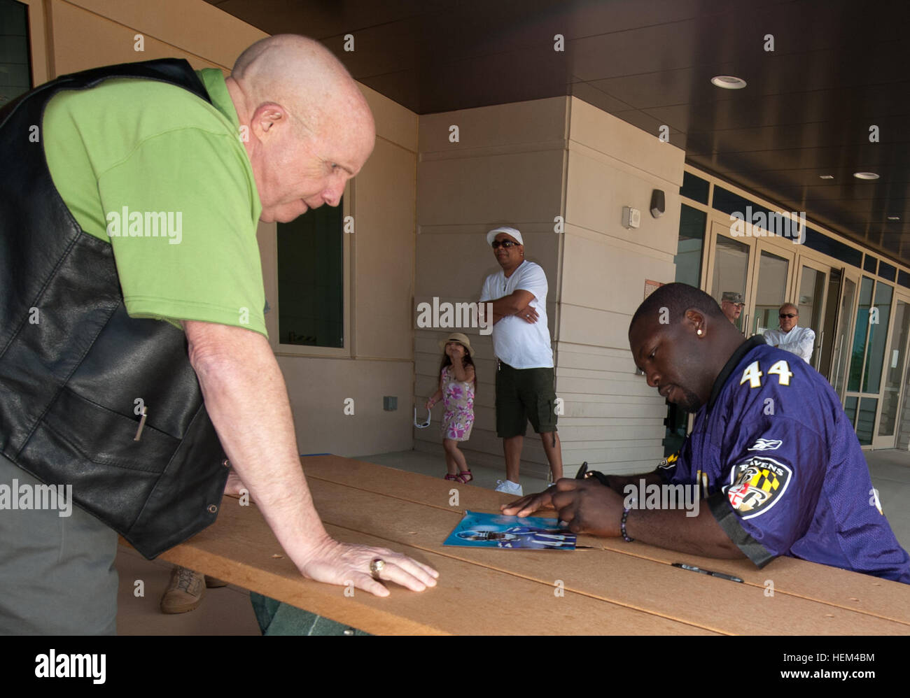 Vonta Leach, a fullback with the Baltimore Ravens, signs photographs ...