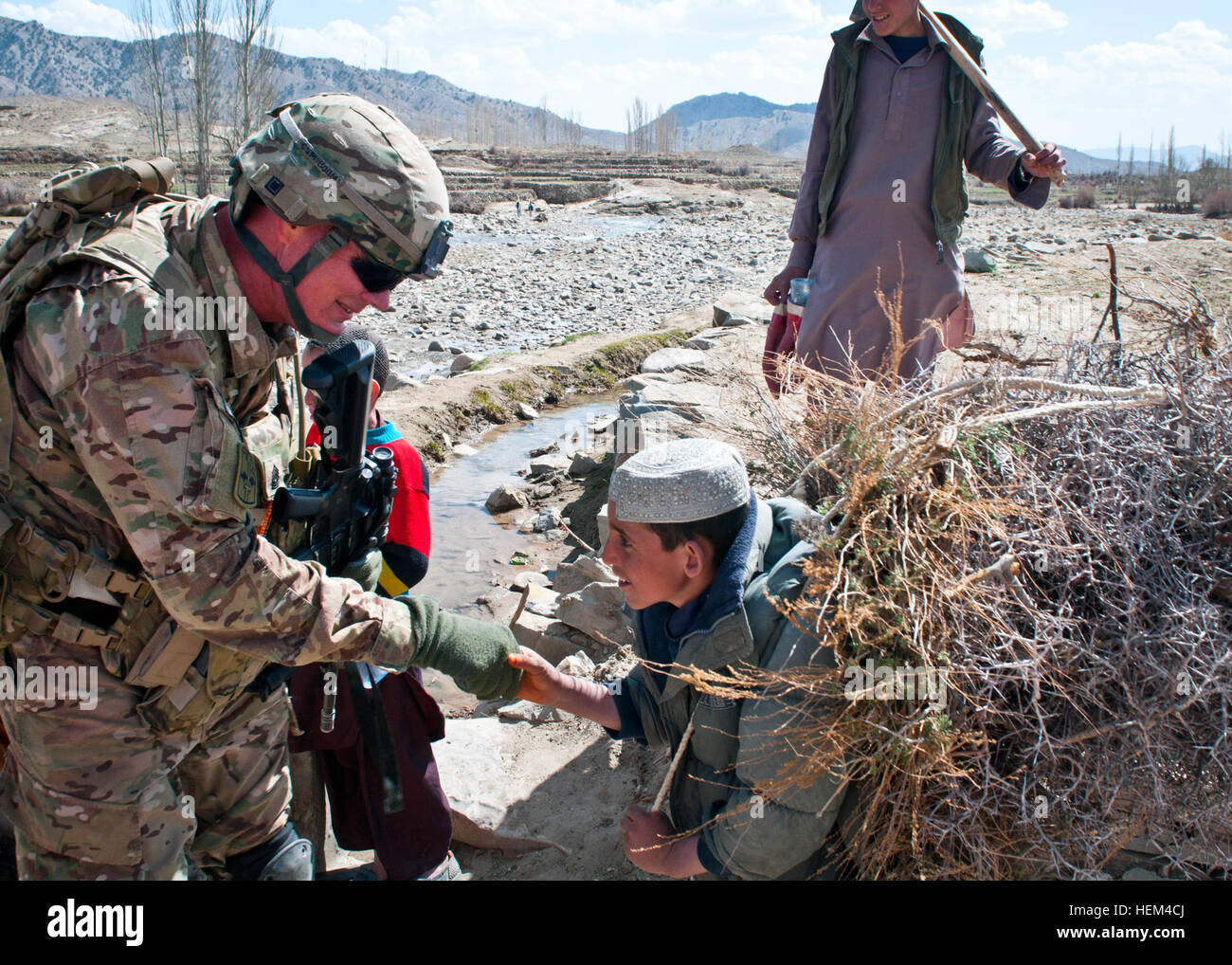 Command Sgt. Maj. Michael Boom, 172nd Infantry Brigade, greets an ...