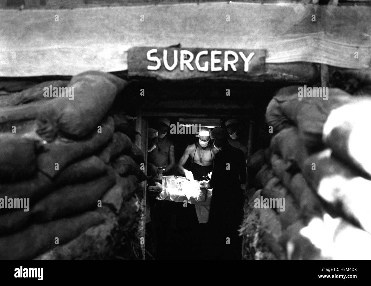 An American Army doctor performs surgery on a wounded U.S. soldier in ...