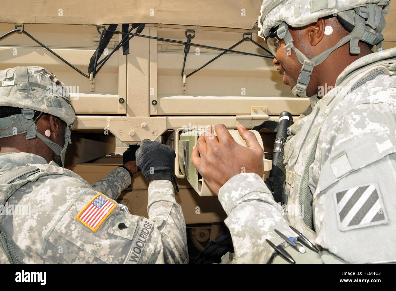 Spc. Monzell Woodridge and Sgt. Frederick Johnson, motor transport ...