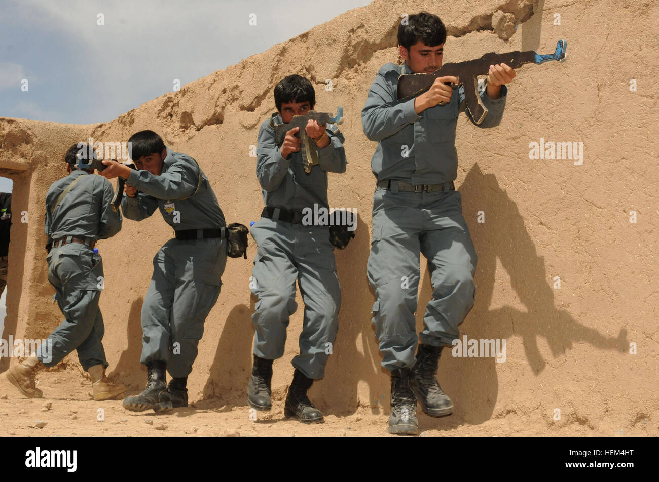 Afghan National Police officers conduct security after entering a ...
