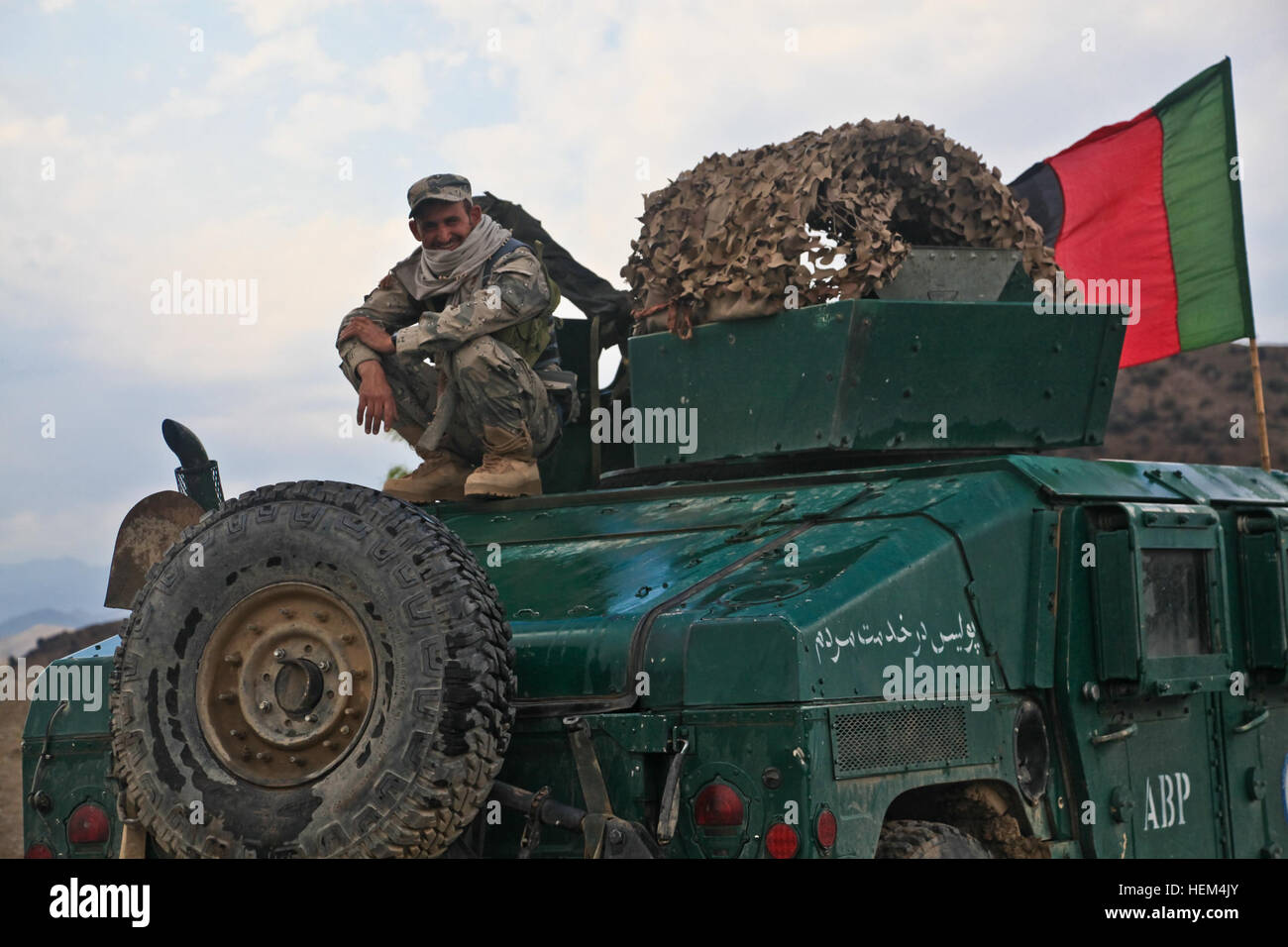 A member of 4th Platoon, 3rd Afghan Border Police Kandak, sits on top ...