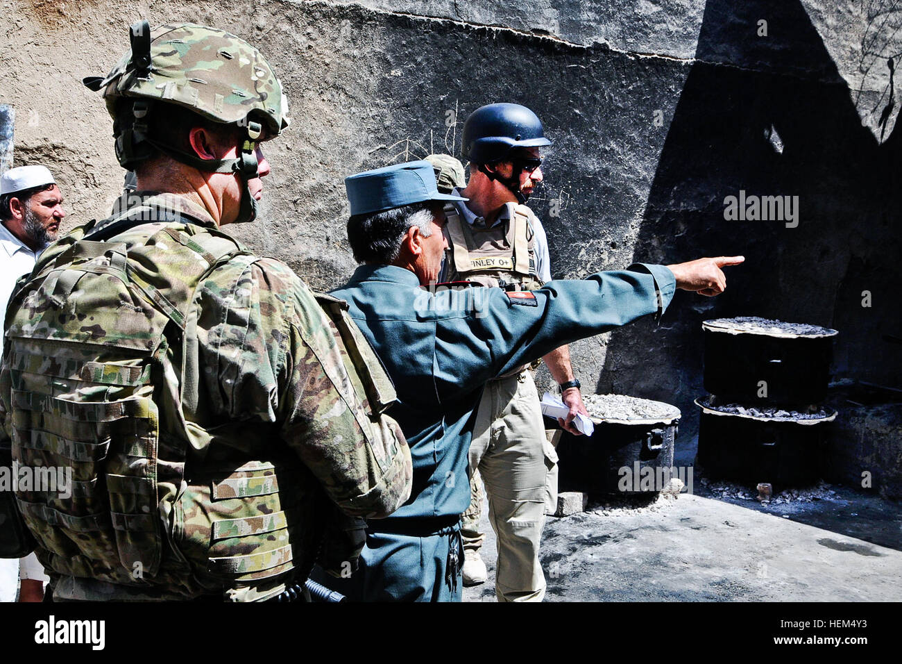 Lt. Col. Abdul Qayoum Azami, Farah City prison warden, leads a tour of ...