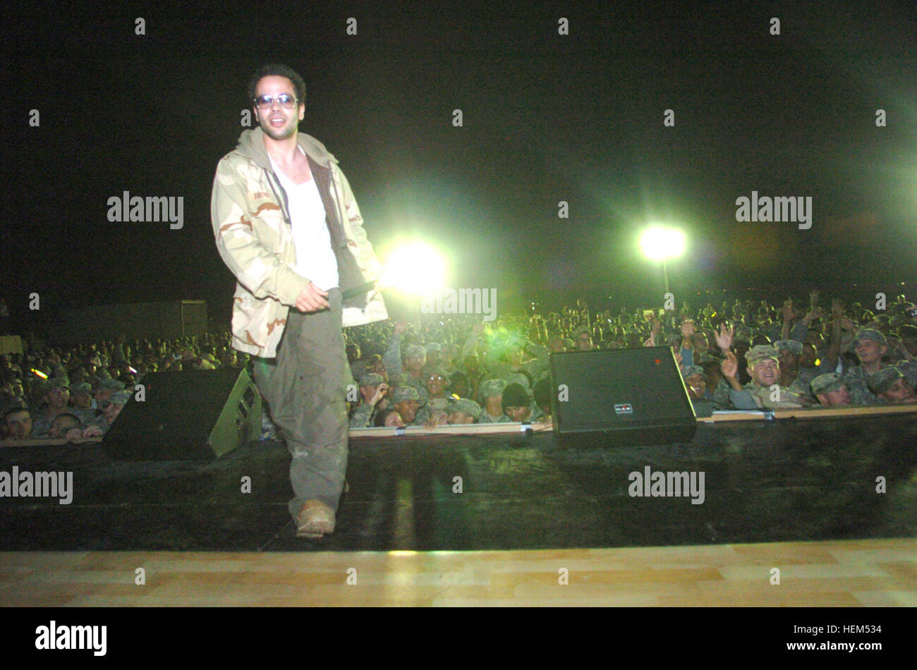 An enthusiastic crowd cheers on rapper Stu Stone as he turns around to ...