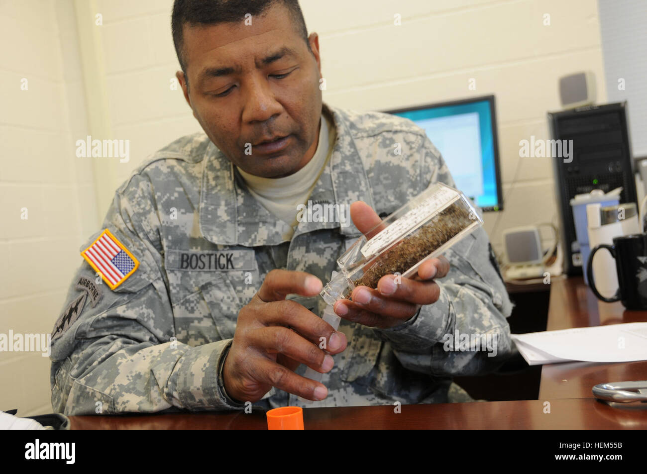 Commander of 1st AML, Col. Anthony Bostick, pours mosquitoes into a ...