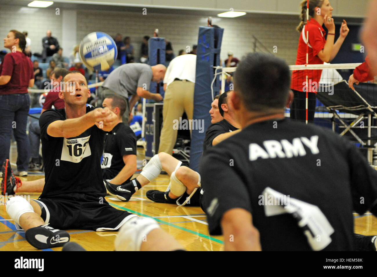 Members of the U.S. Army sitting volleyball team warm up before their ...