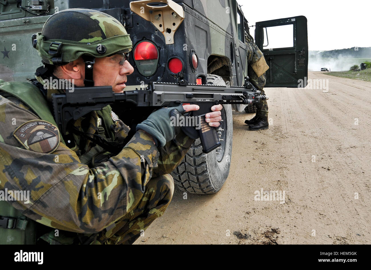 A Czech soldier provides security while his convoy is stopped during ...
