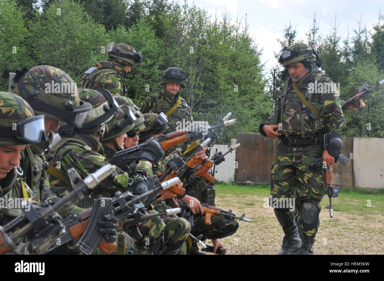 Romanian army 1st Lt. Craciun Burcea, right, has his soldiers perform a ...