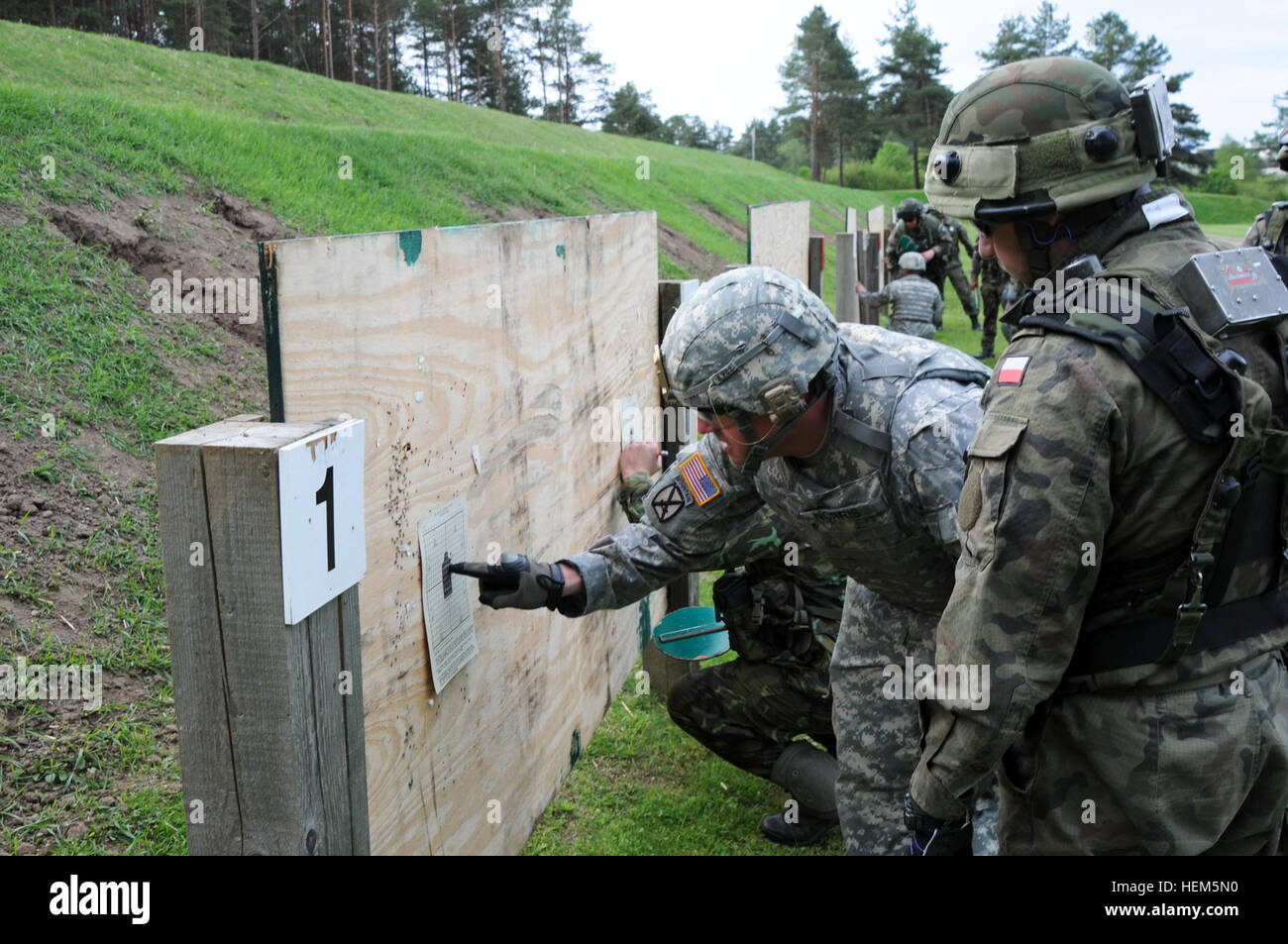 U. S. Army Capt. Edward Norris, Adler observer controller team, checks ...