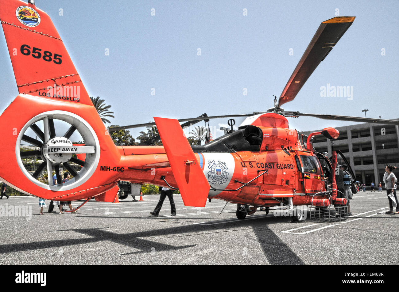 Members of the public line up to look inside a Coast Guard MH-65C ...
