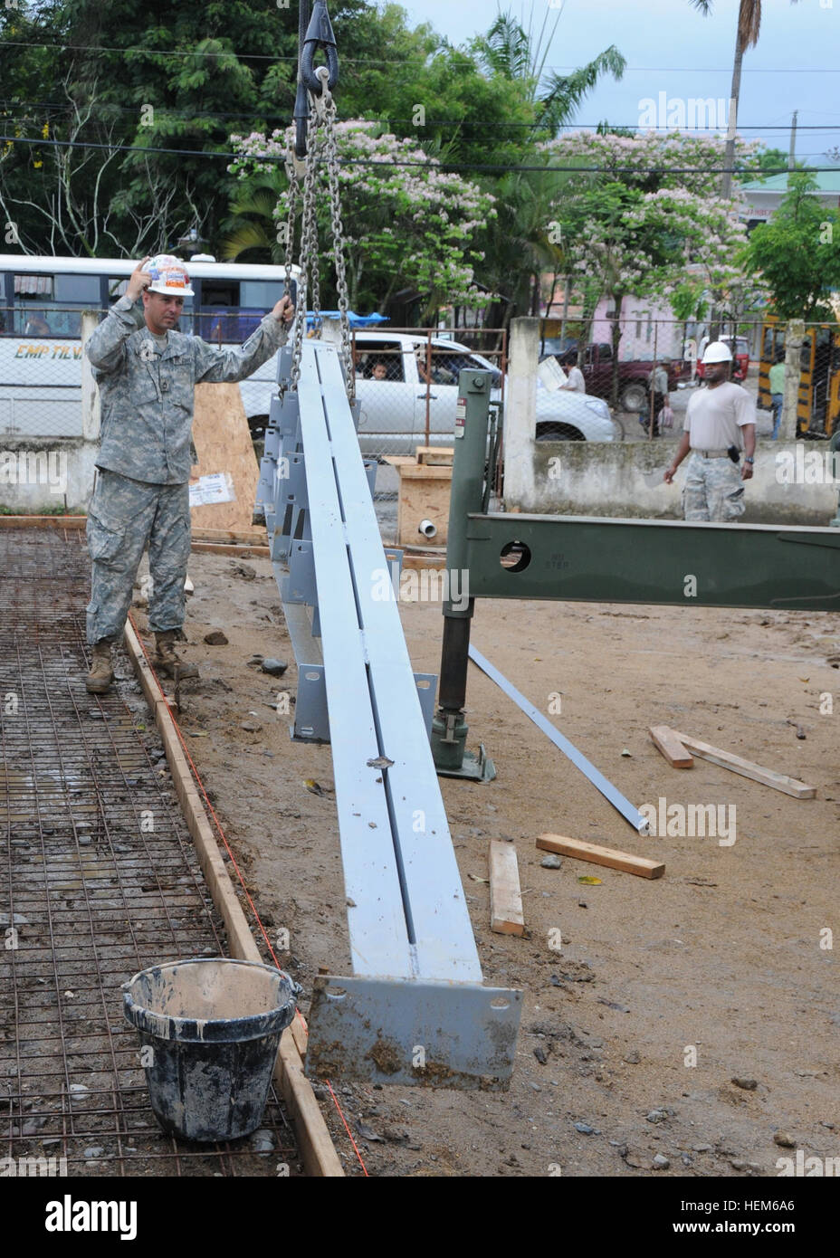 U.S. Army engineers work at Quimistan construction site to install roof ...