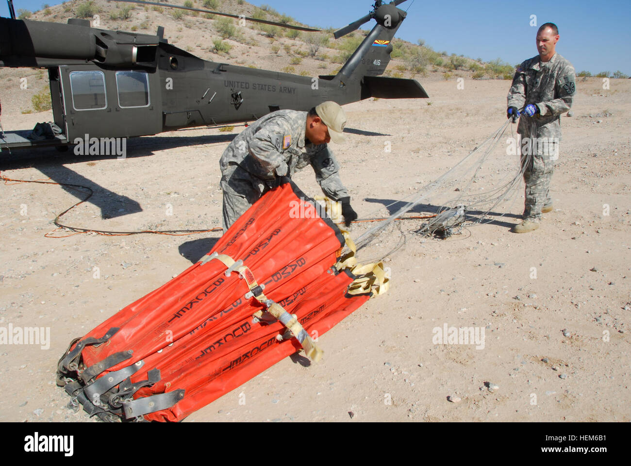 Staff Sgt. Marco Lechuga and Spc. David Shrock, flight crew chiefs from ...