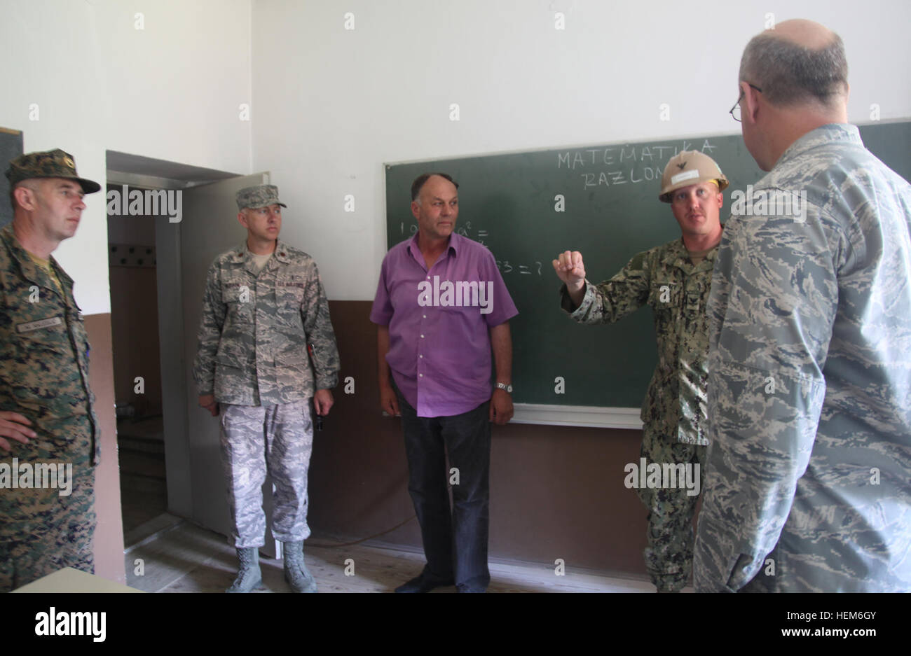 Petty Officer Second Class Richard Stansbury, second from right, speaks ...