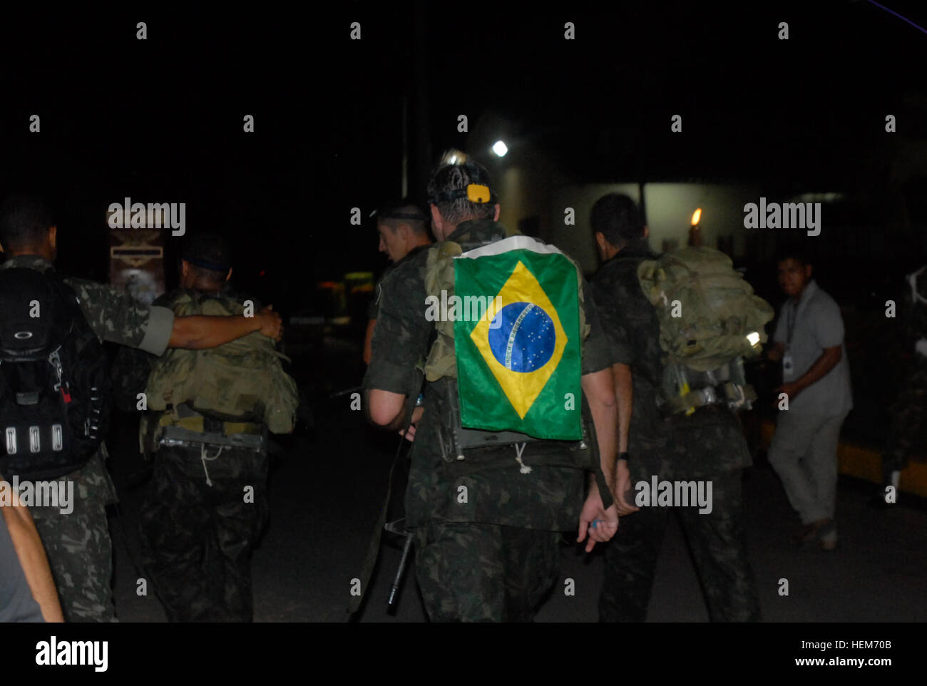 The special operations forces team from Brazil crosses the finish line ...