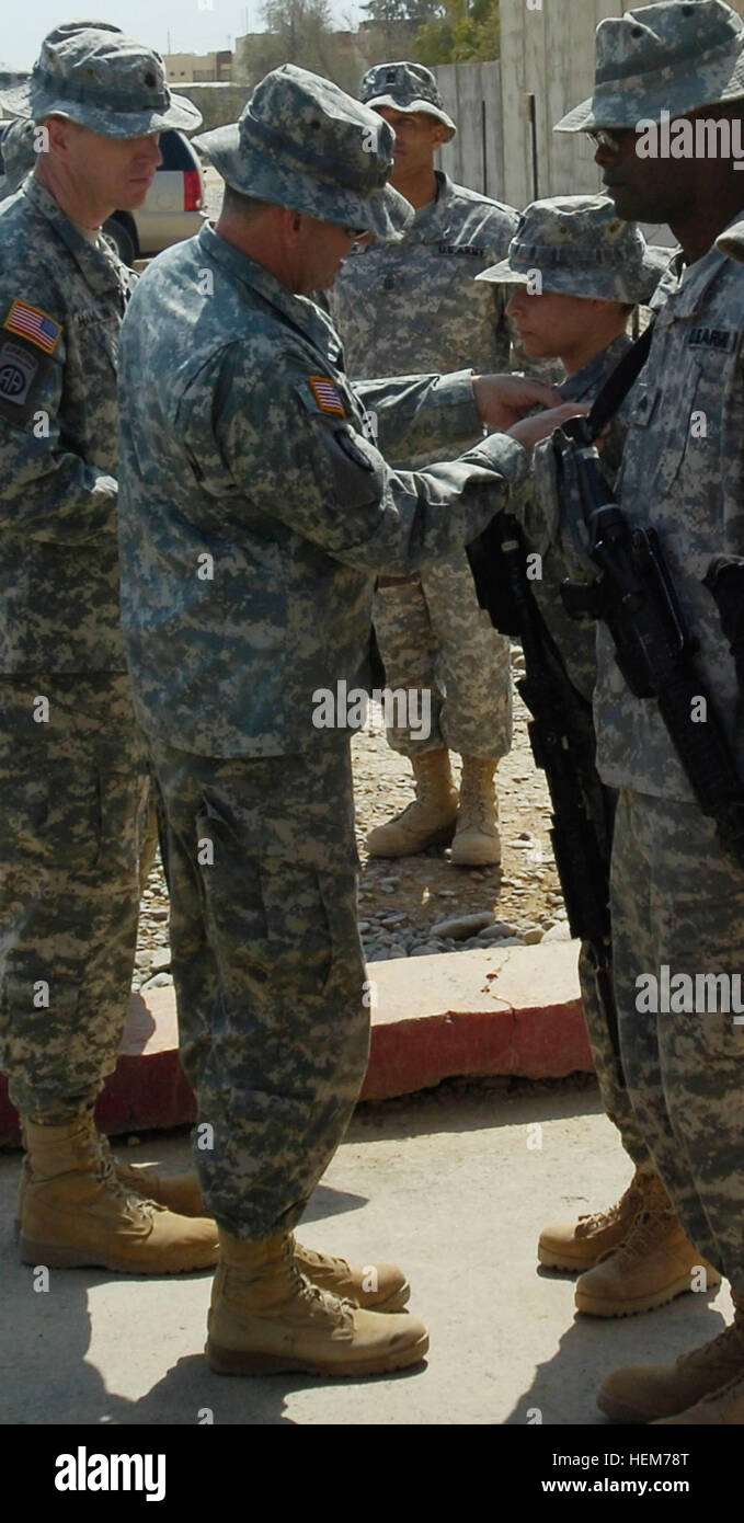 Maj. Gen. Benjamin R. Mixon, 25th Infantry Division commander, pins a ...