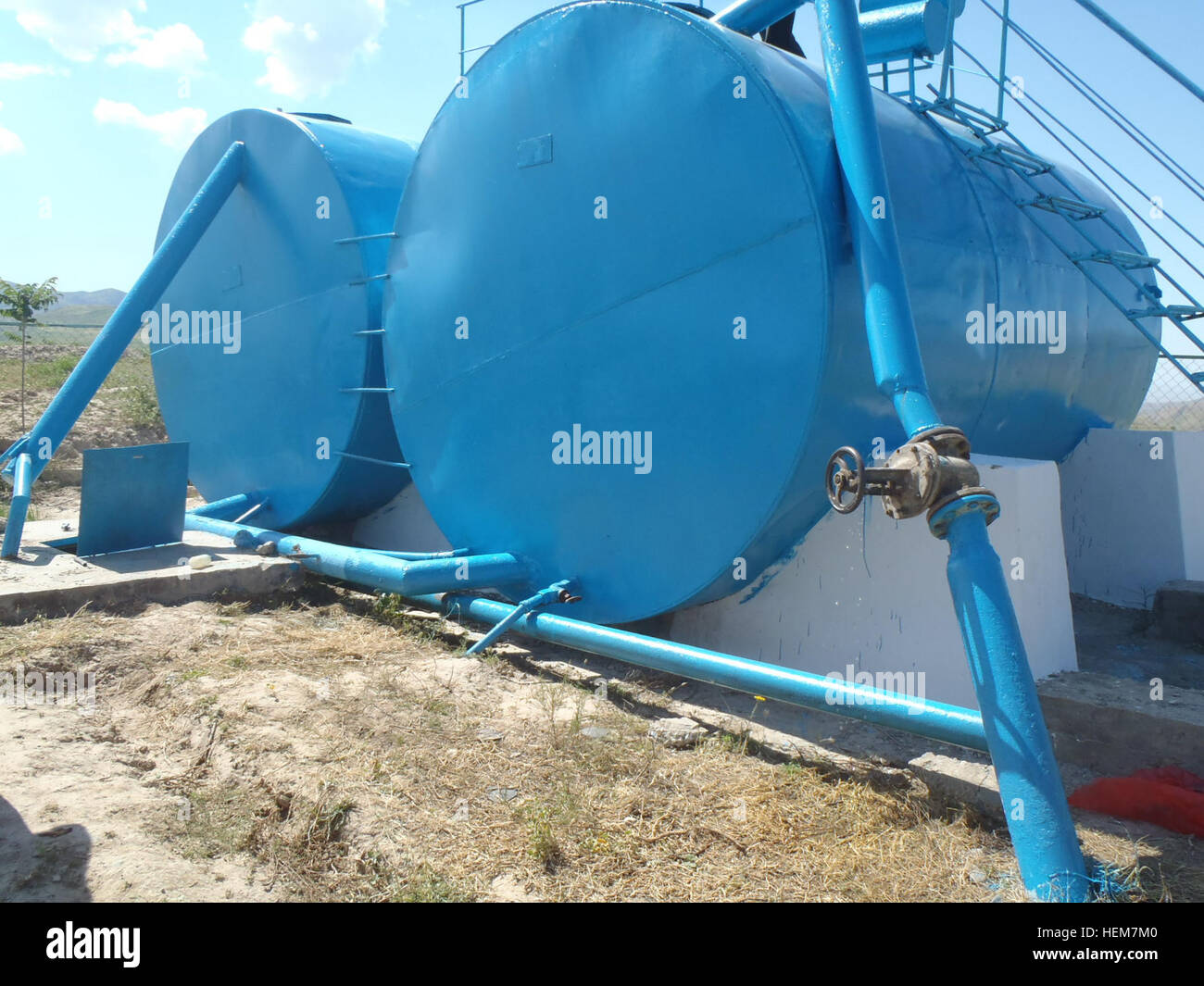 Two 25,000 liter tanks hold clean water for distribution to outlying ...