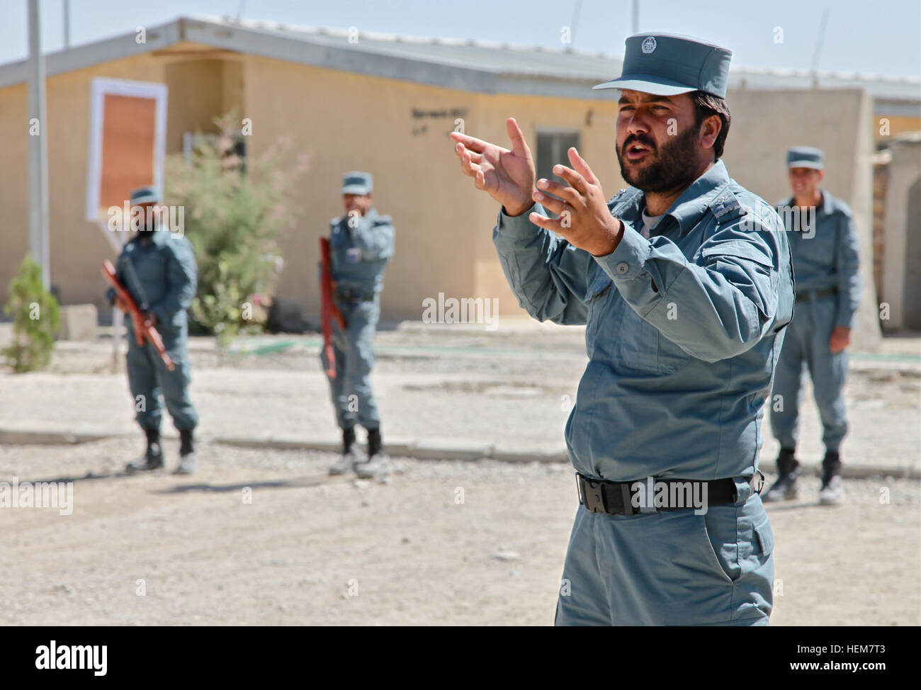 An Afghan Uniform Police instructor speaks to his recruits before they ...