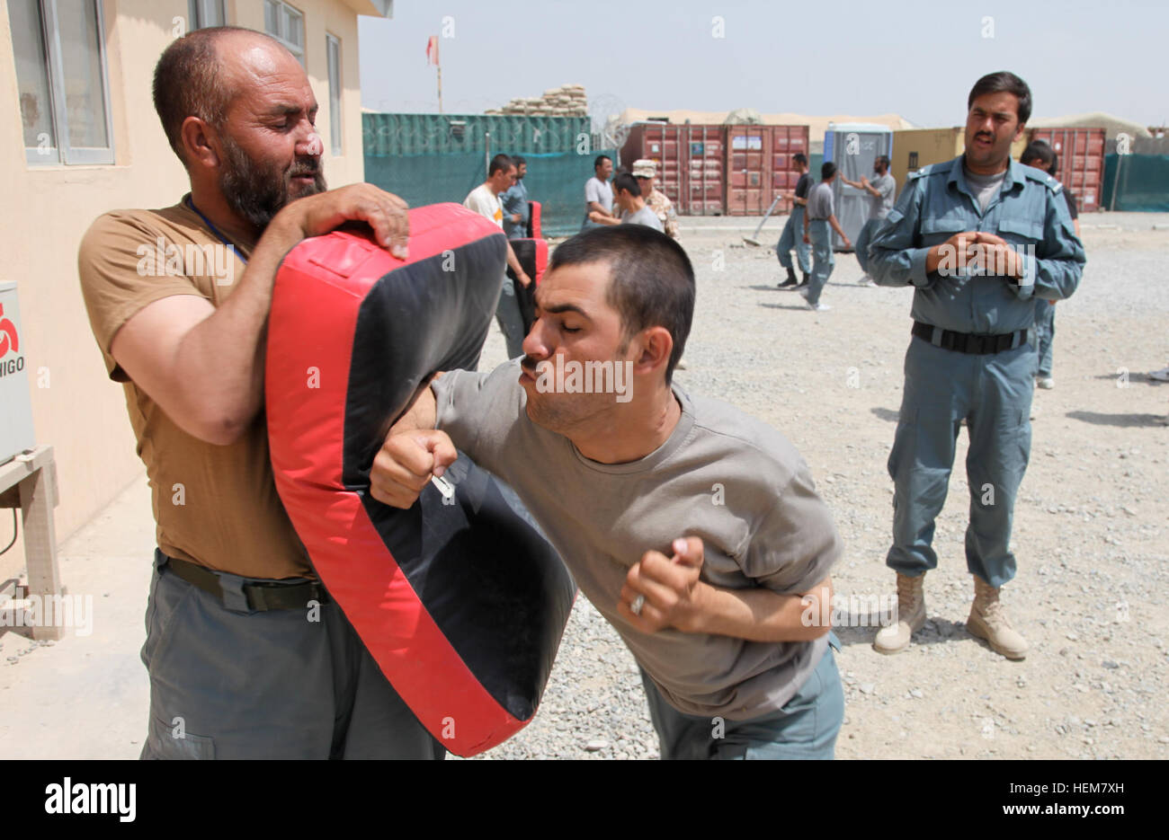 An Afghan Uniform Police recruit practices an elbow attack using a ...