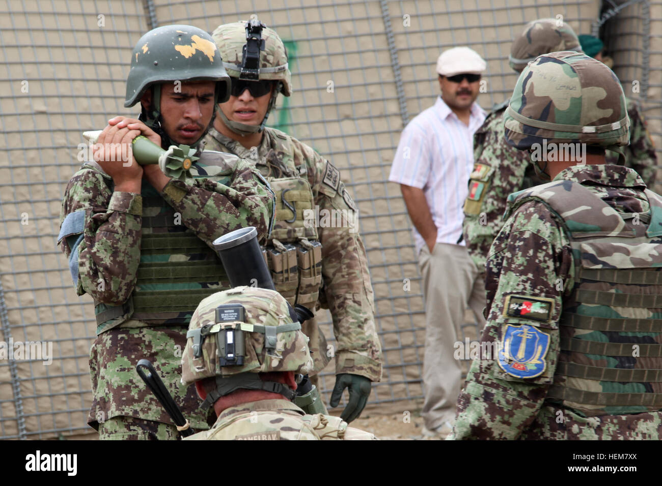 Afghan National Army soldiers prepare to fire high explosive mortars ...