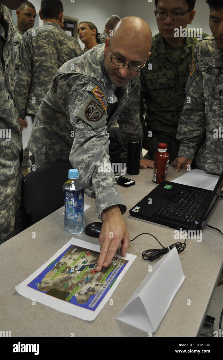 Staff Sgt. Tim Burton, U.S. Army Reserves, Hawaii, explains map ...