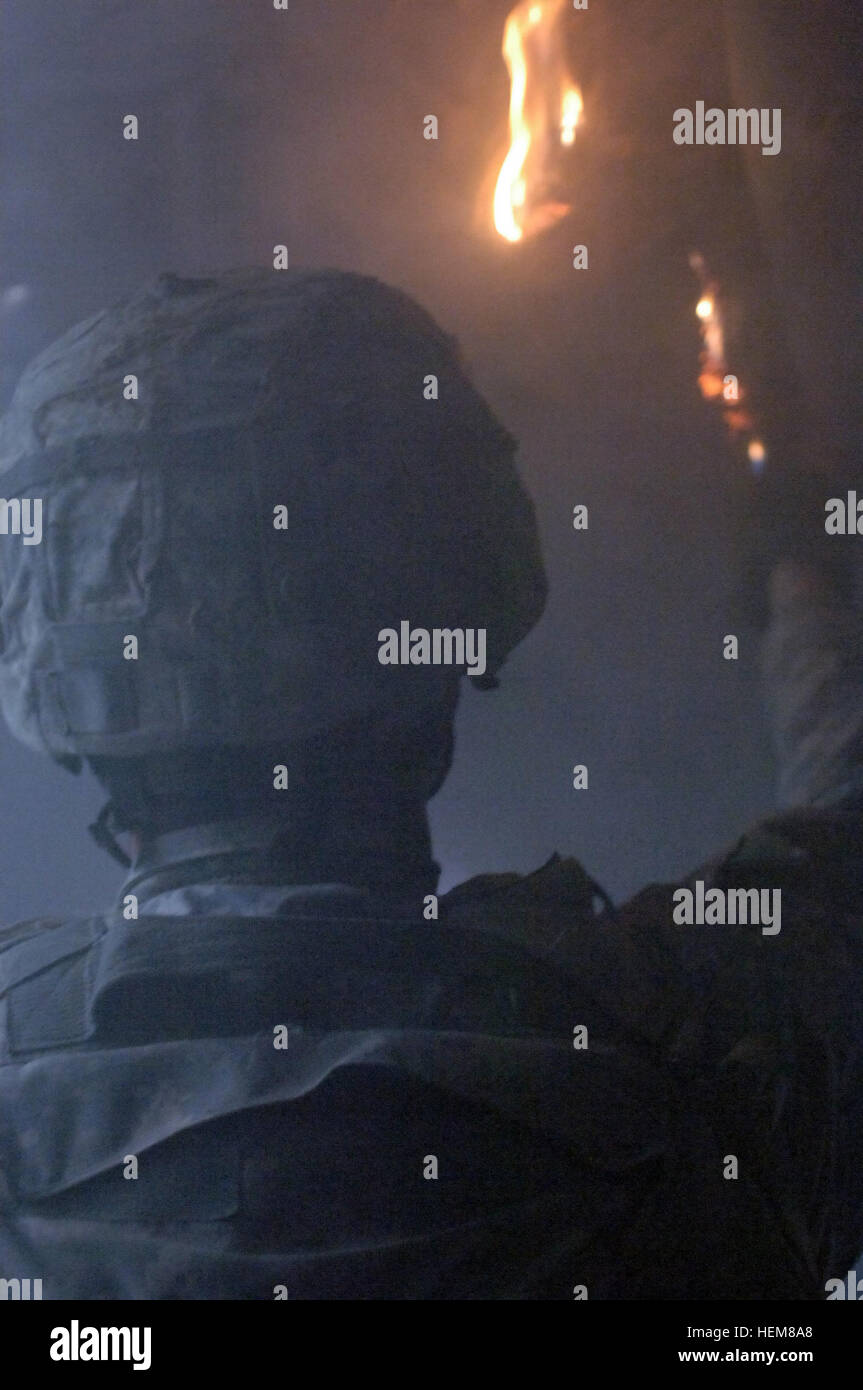 A Soldier from Charlie Company 2/87 Infantry sets fire to a Taliban ...